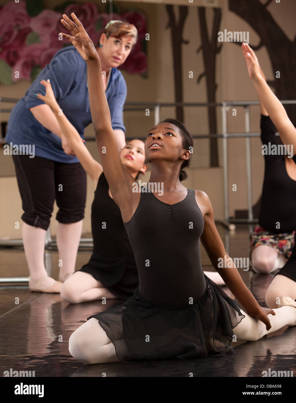 Kneeling Dance Students Stock Photo - Alamy