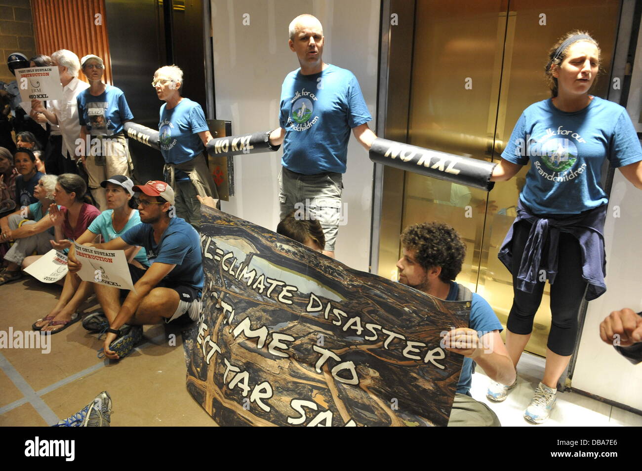 Washington, DC, USA. 26th July, 2013. Protesters with arms locked ...