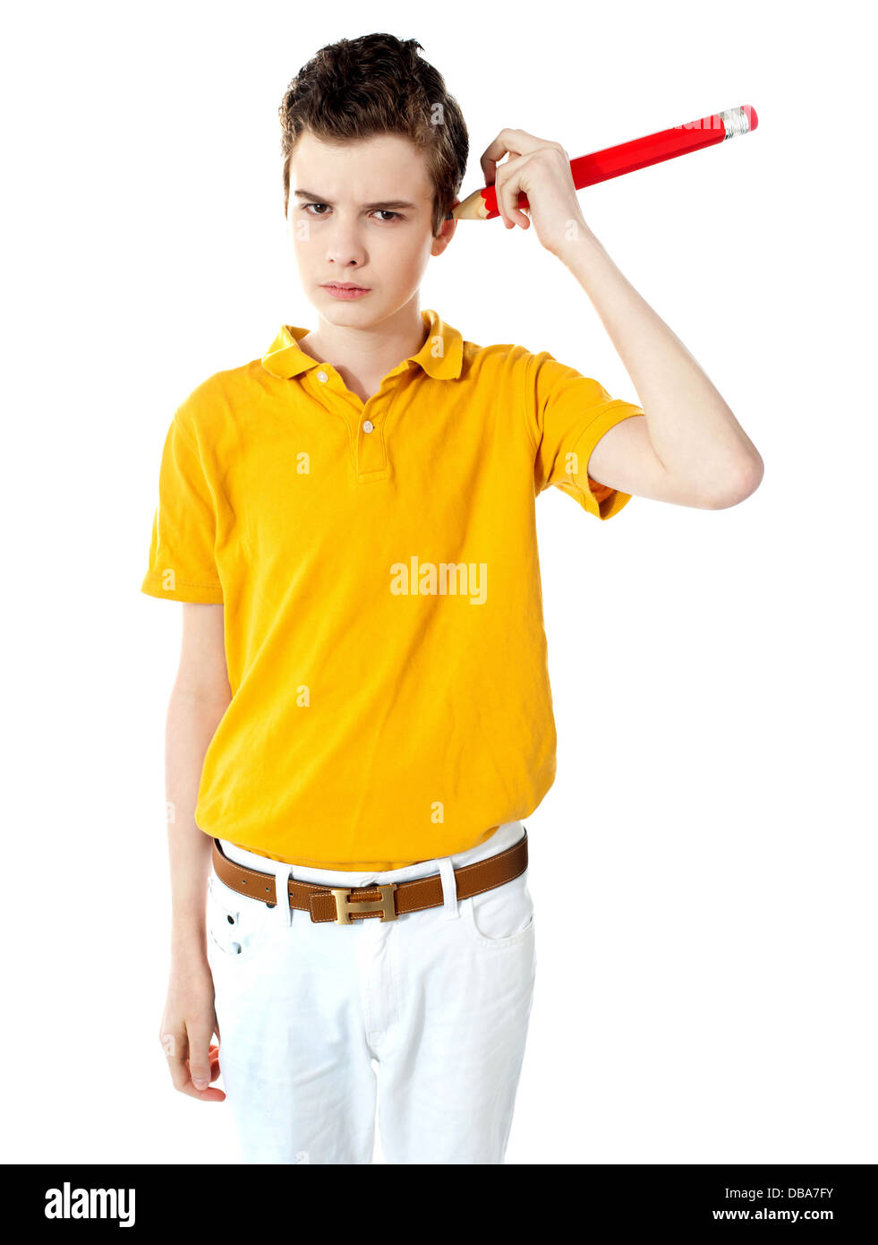 Boy cleaning his ear with big pencil Stock Photo - Alamy