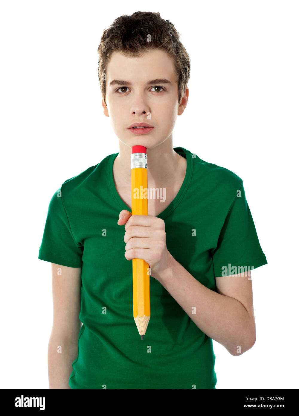 School boy thinking while holding pencil Stock Photo - Alamy