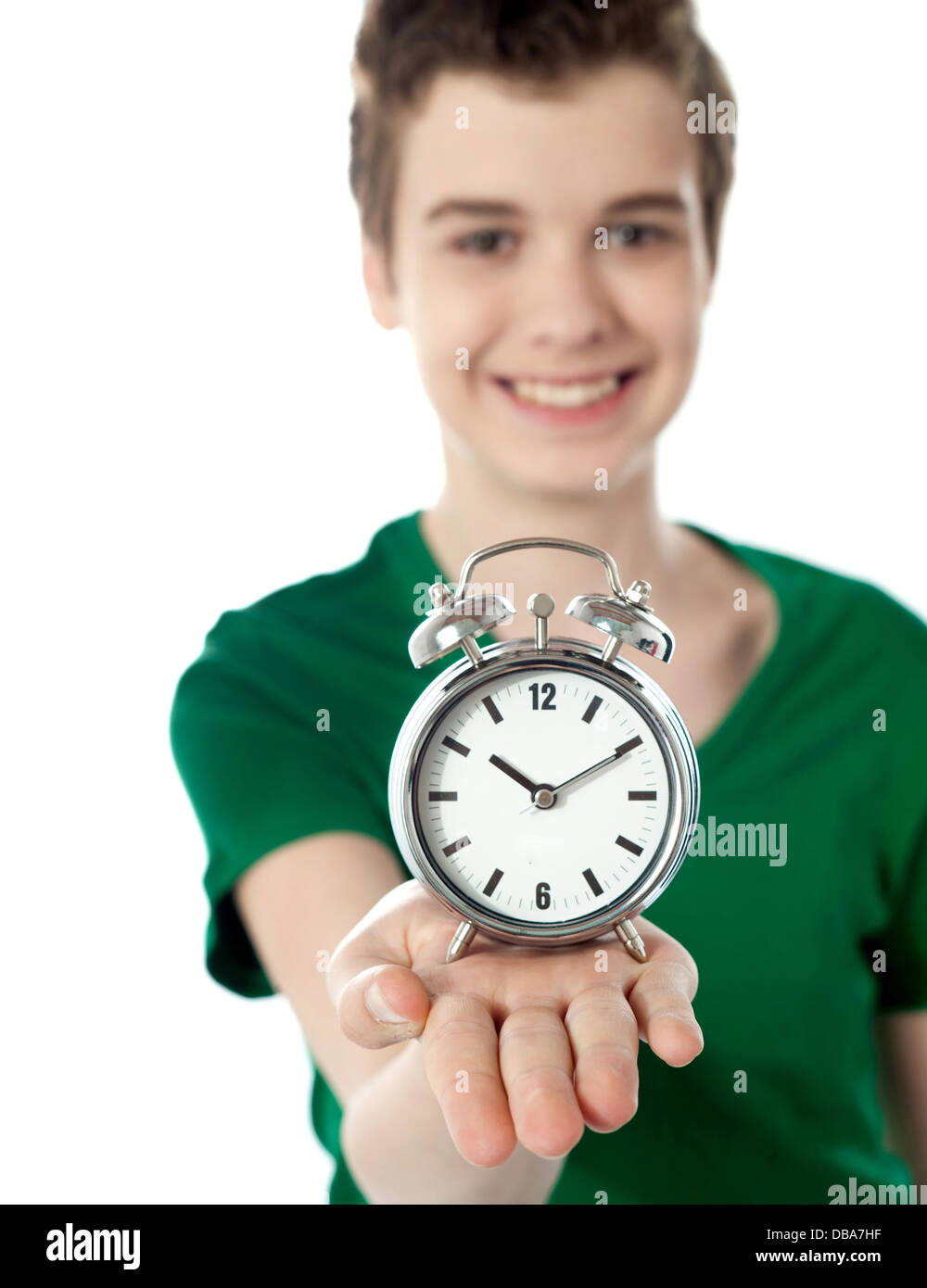 Adorable boy with a alarm clock Stock Photo - Alamy