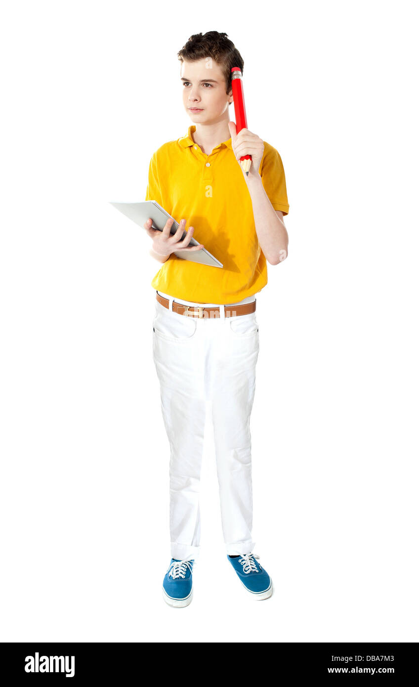 Cute young boy thinking hard Stock Photo - Alamy