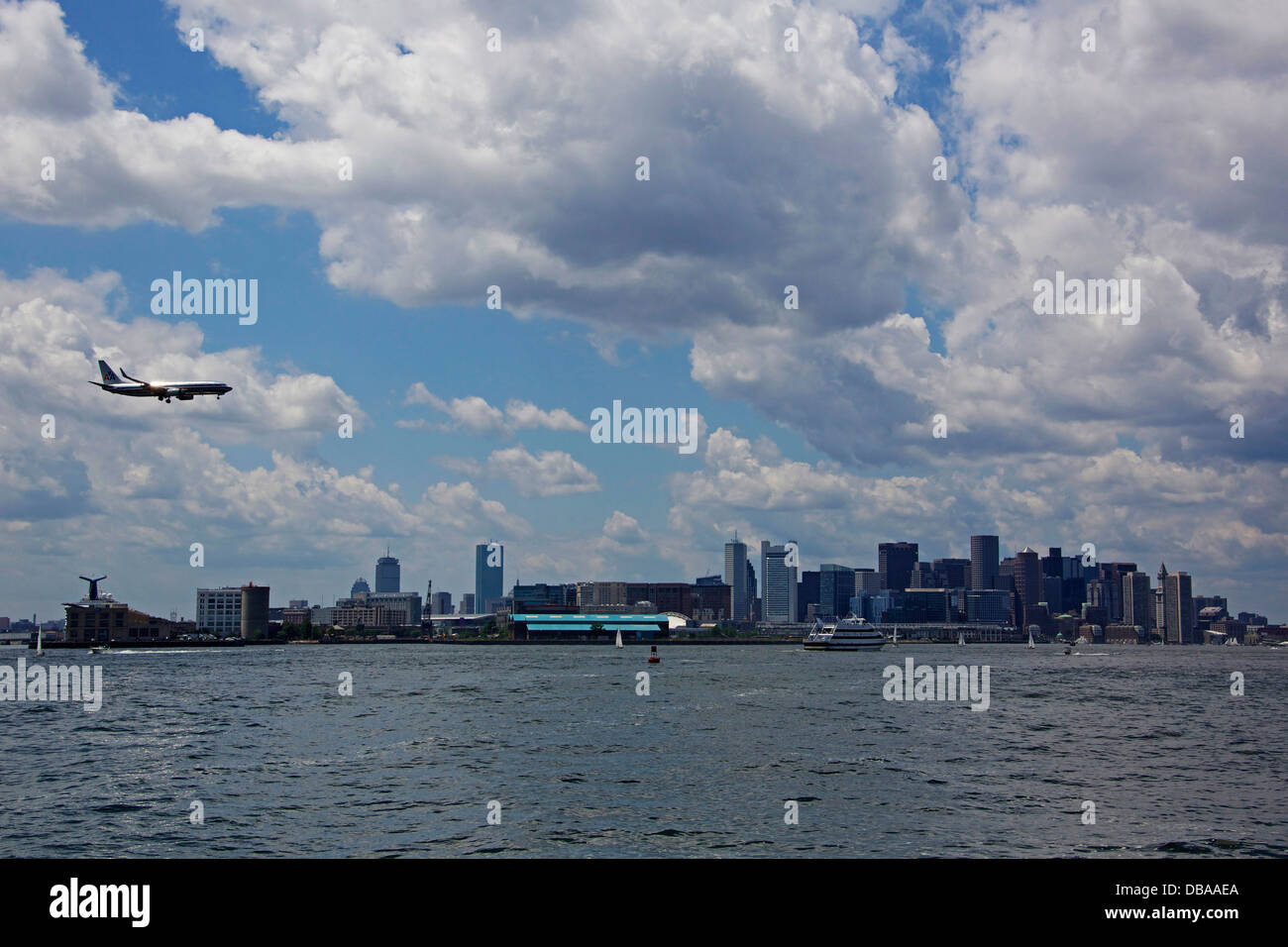 Boston, Massachusetts, USA skyline seen from the Atlantic with airplane ...