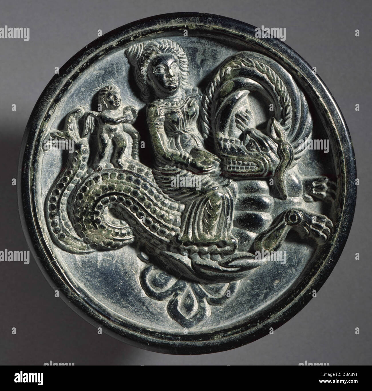 This ancient Greek ritual tray depicts a nereid, a sea nymph, alongside ...