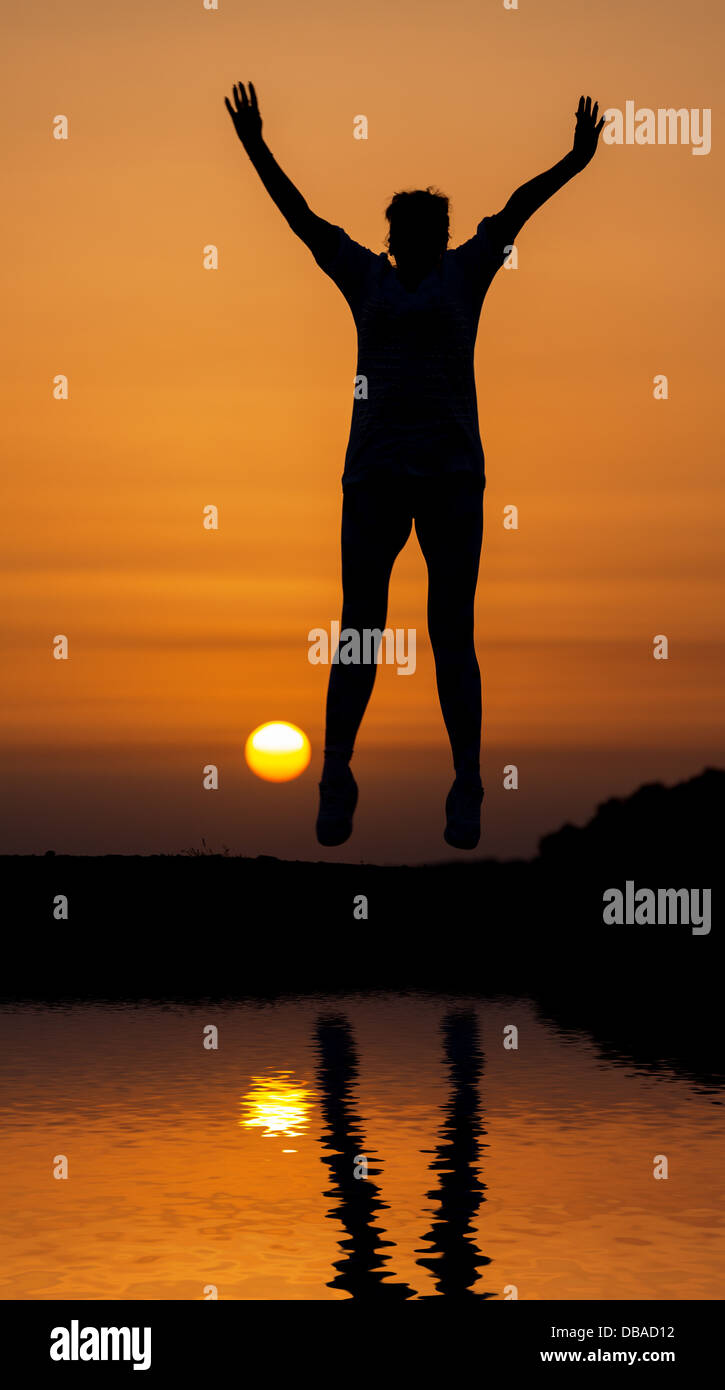 Jumping woman at sunset hi-res stock photography and images - Alamy