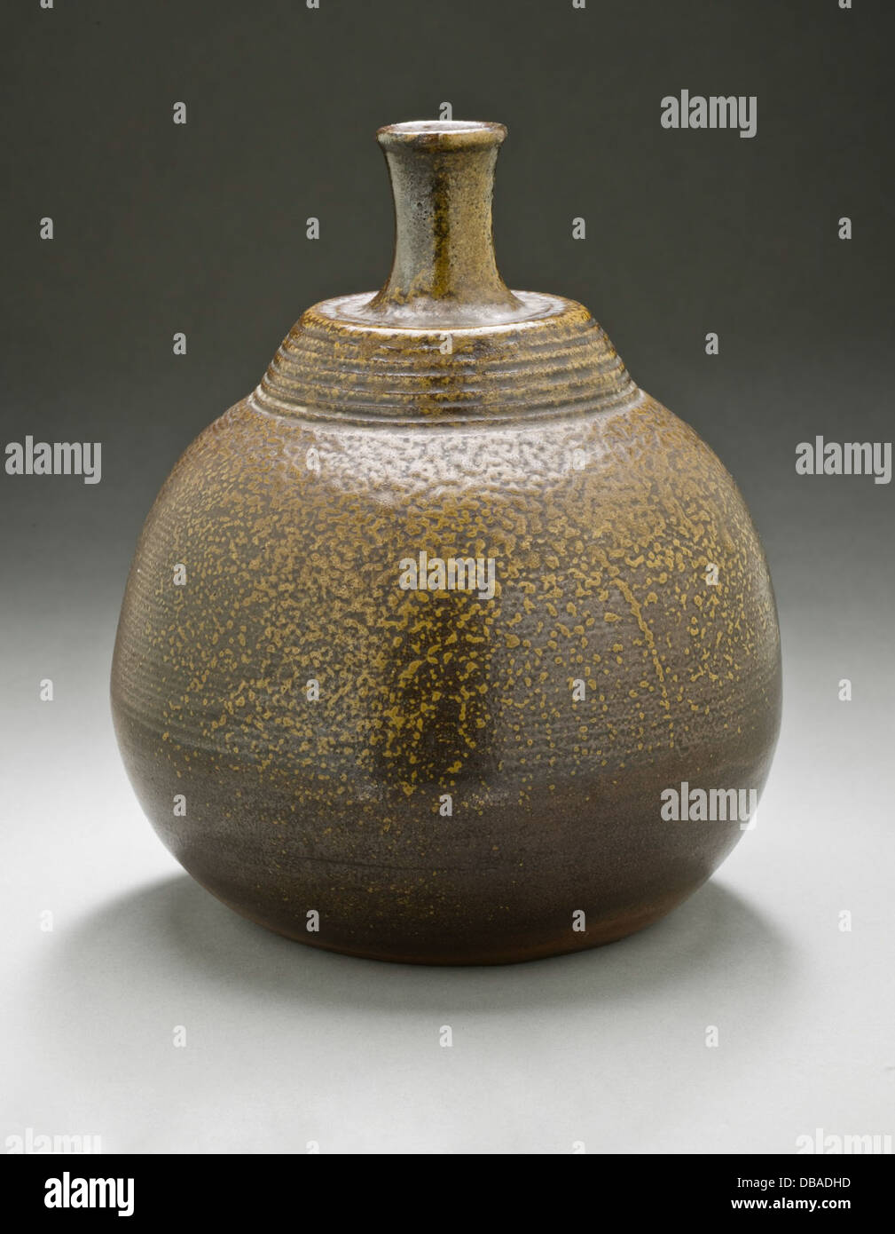 This tokkuri, a traditional Japanese sake bottle, is designed for ...