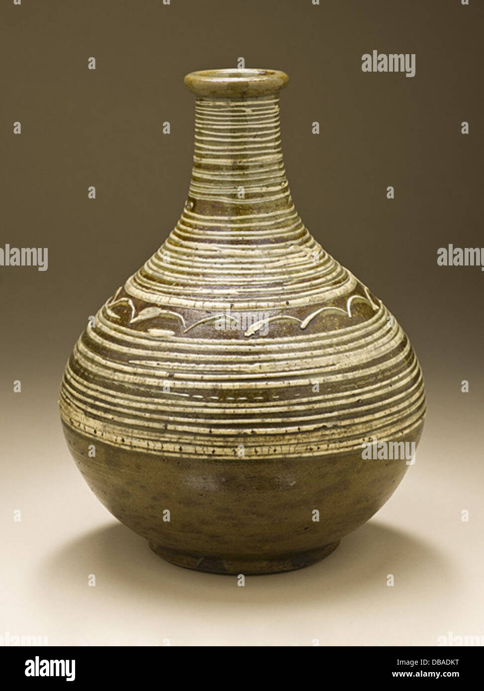 This sake bottle, or tokkuri, is a traditional Japanese ceramic vessel ...
