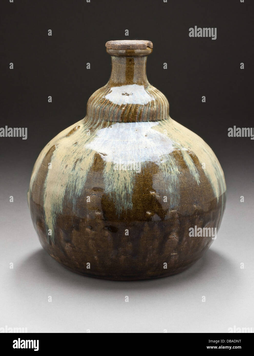 This sake bottle (tokkuri) is a fine example of Japanese ceramic ...