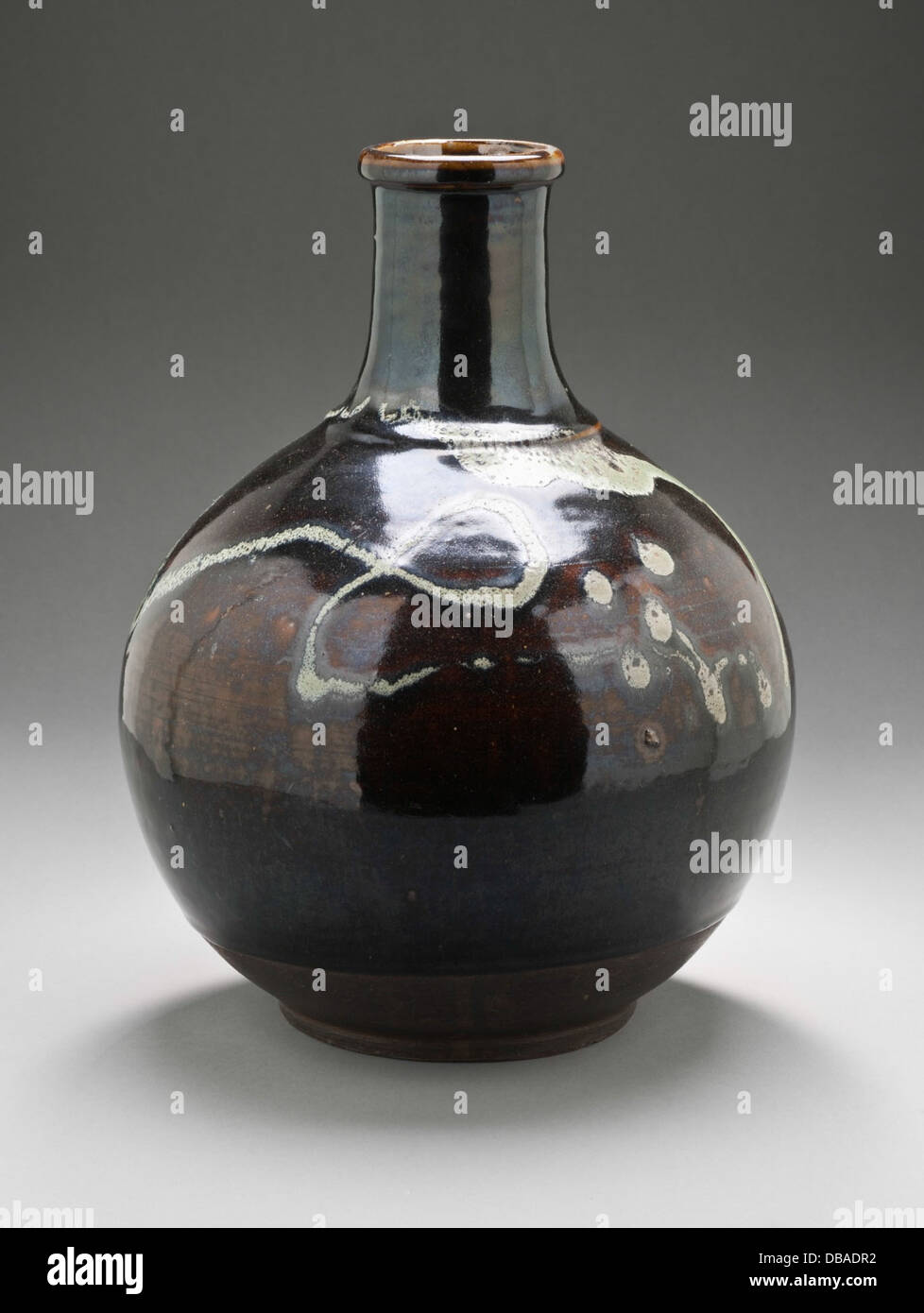 This sake bottle (tokkuri) is a traditional Japanese ceramic vessel ...