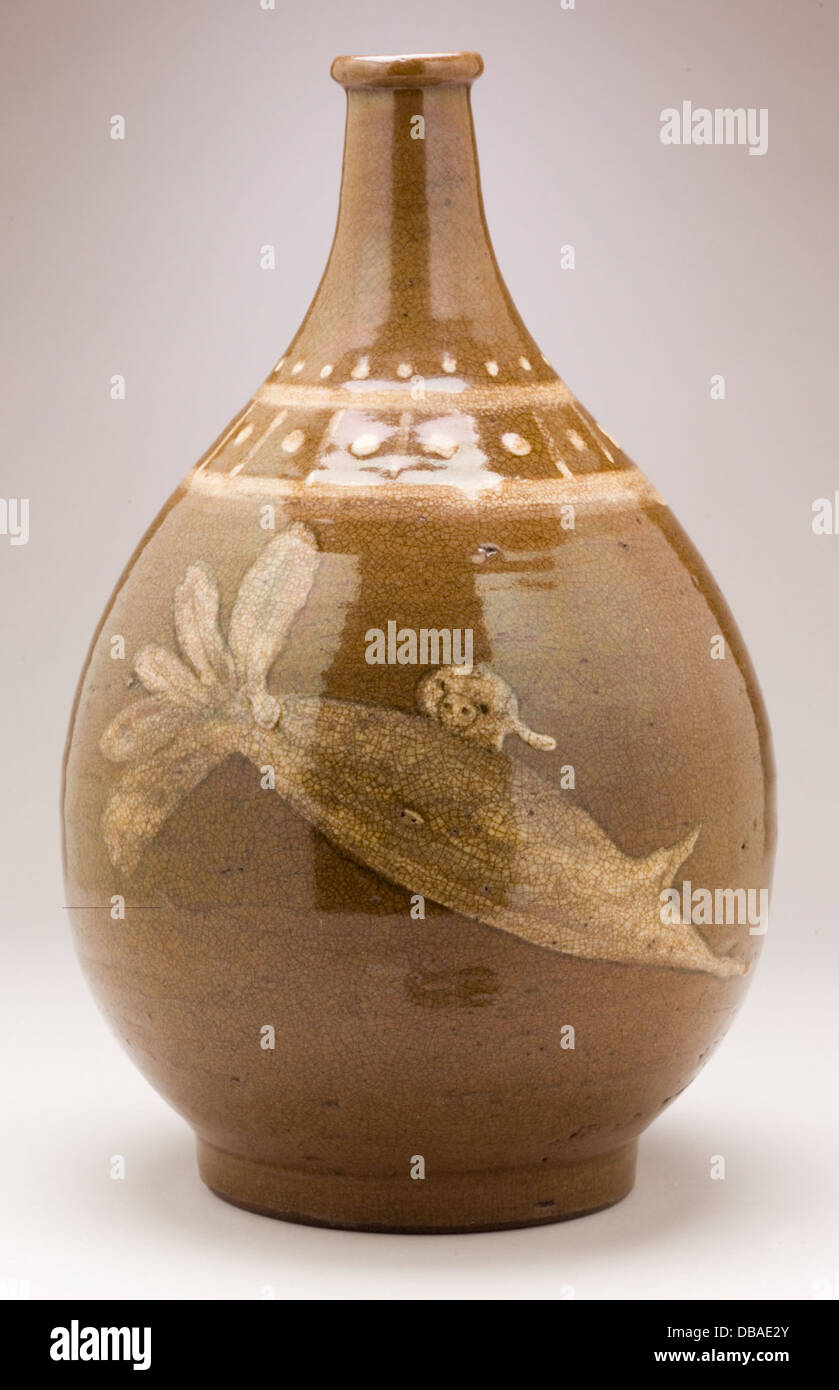 This sake bottle, known as tokkuri, features a daikon radish design ...