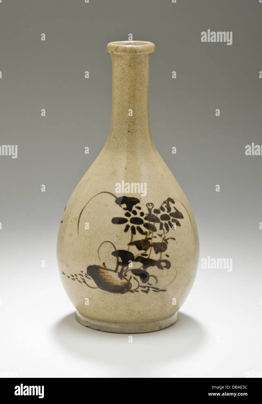 This Japanese sake bottle, or tokkuri, features intricate designs of ...