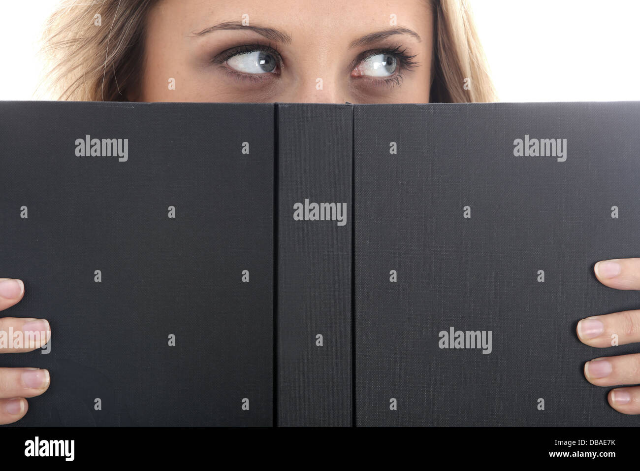 Woman Peering Over Book High Resolution Stock Photography and Images ...