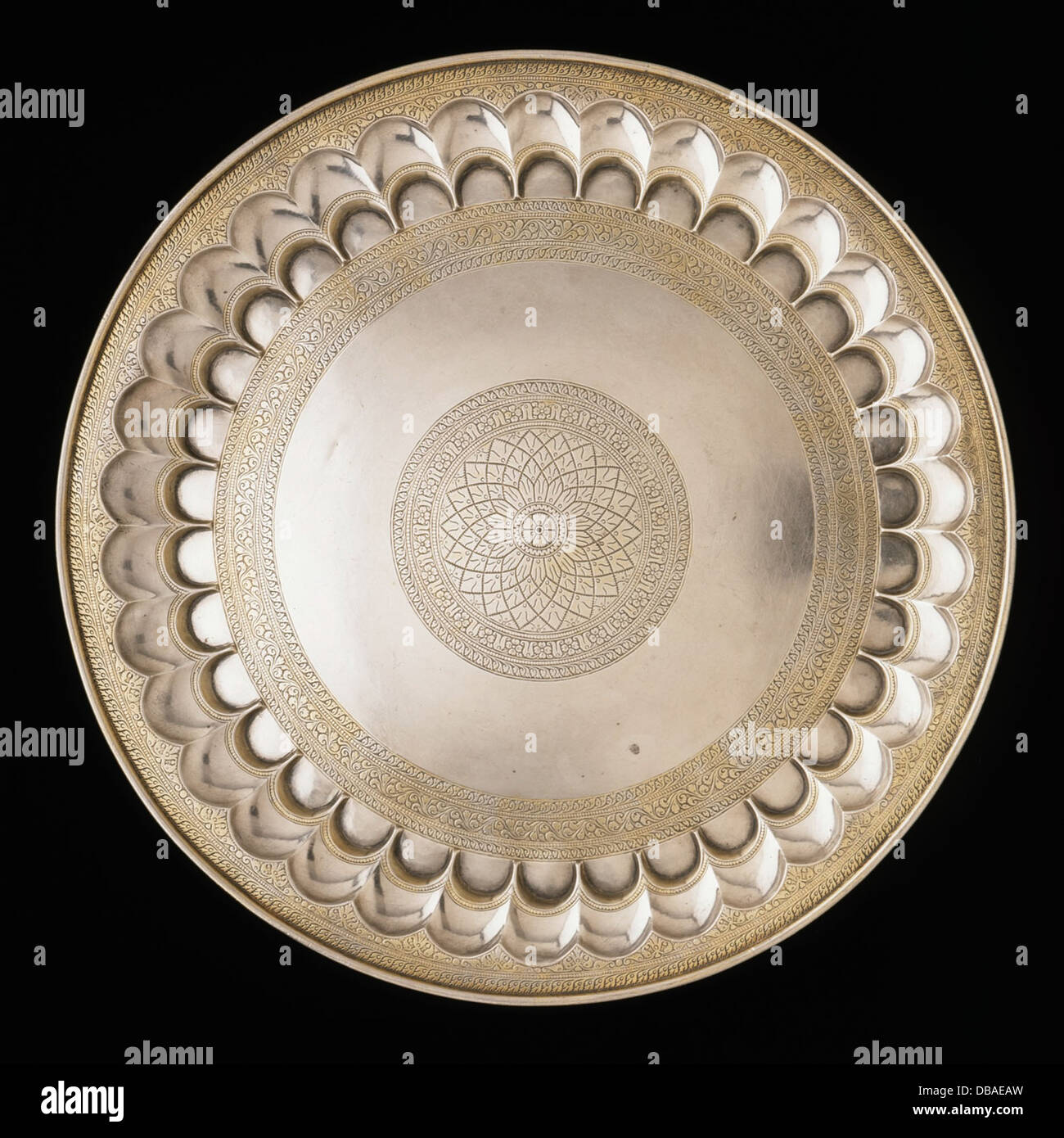This salver, a decorative serving tray, features intricate ...