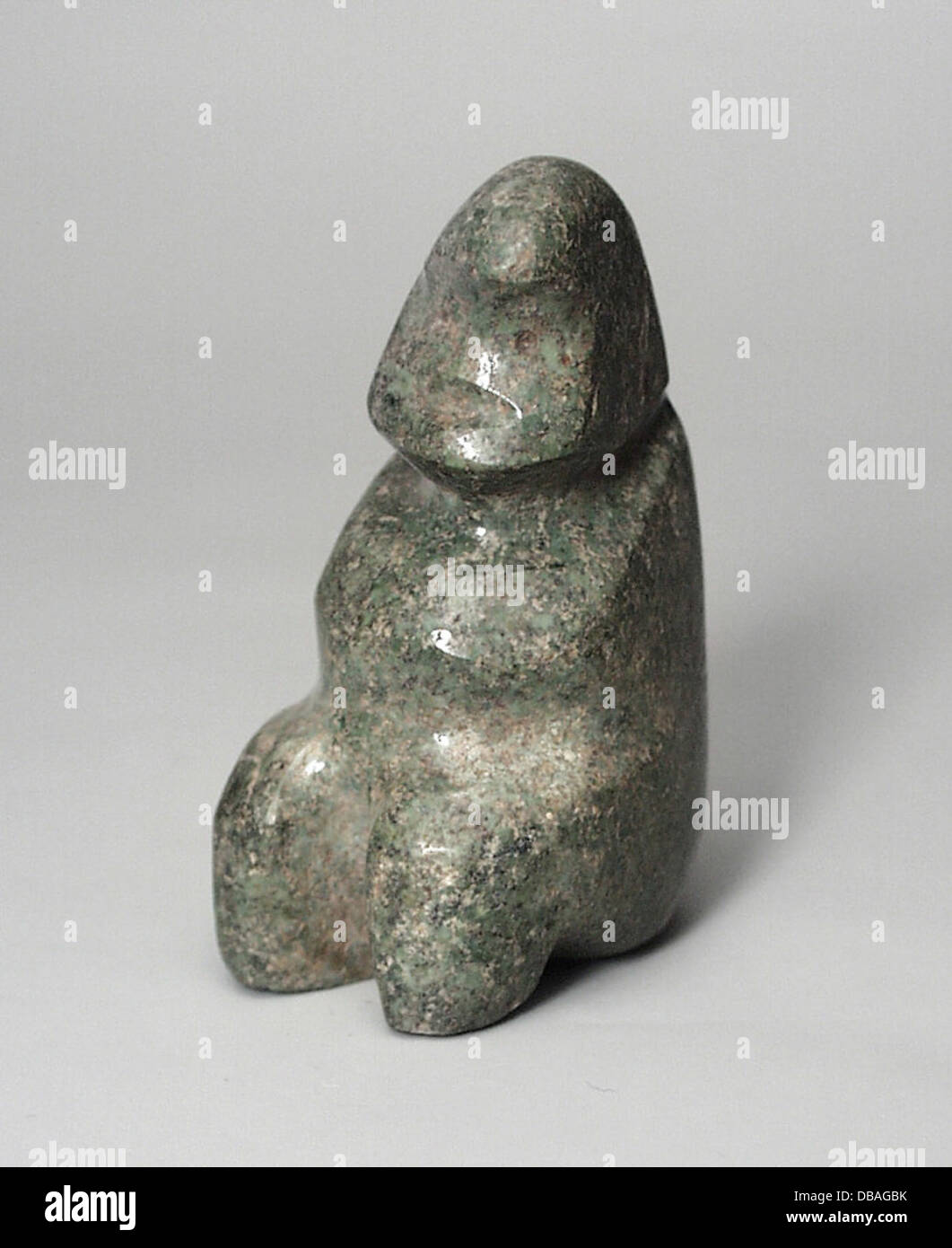 This seated figure is a sculptural representation, carved with fine ...