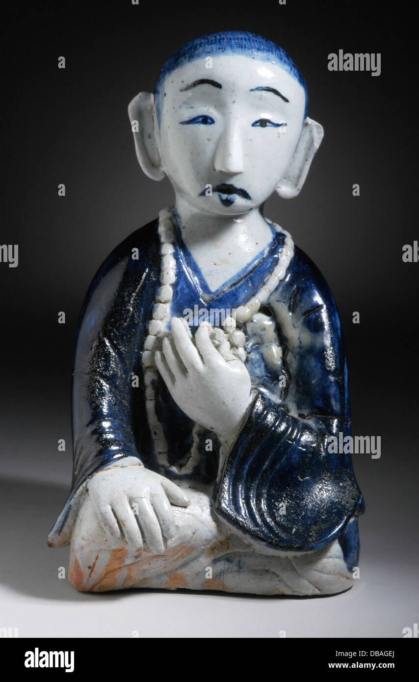 A seated monk sculpture, depicting spiritual serenity and classical ...