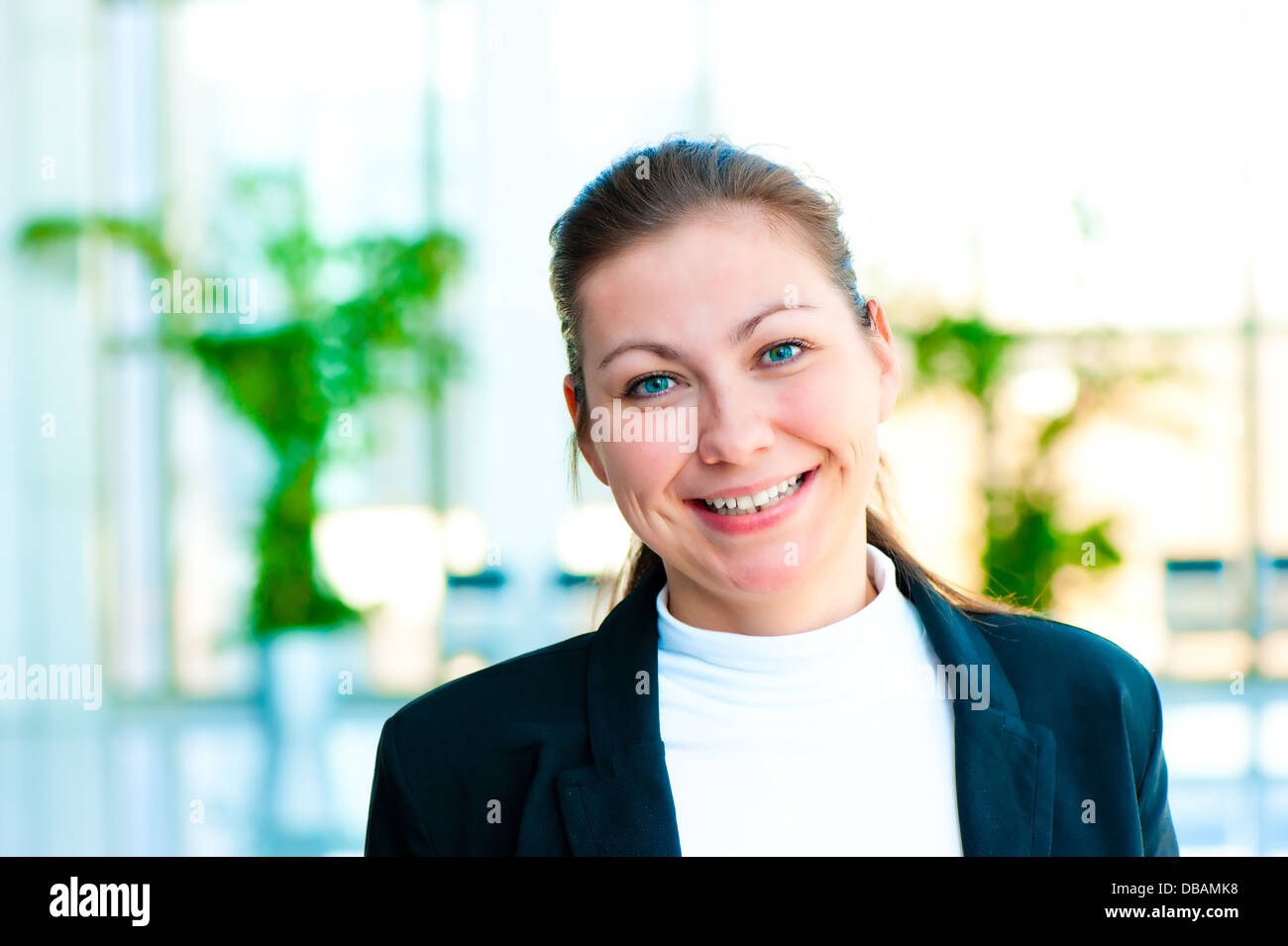 Portrait of a smiling girl on the background of the manager de-focus ...