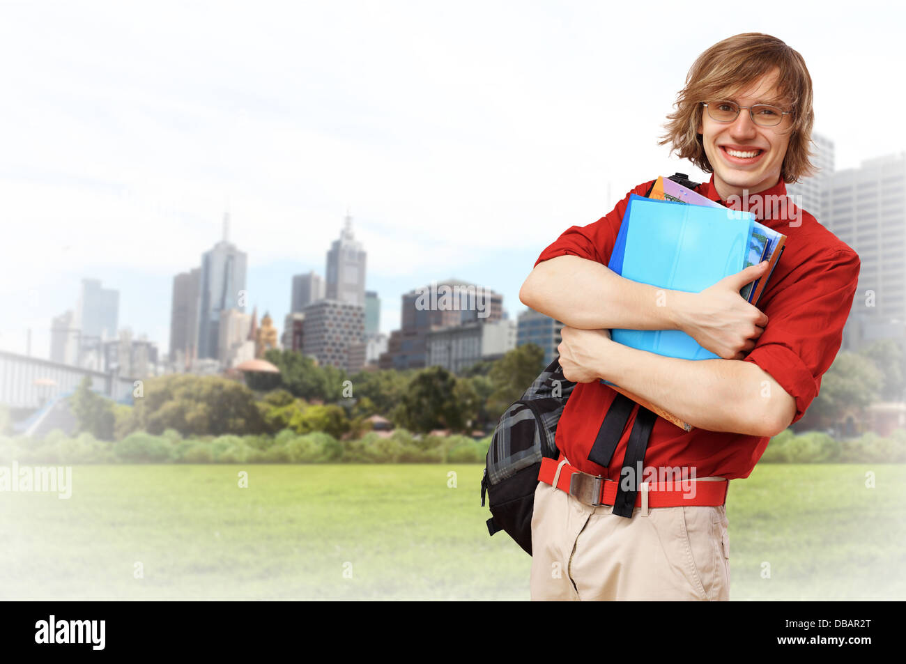 Happy student with books Stock Photo - Alamy