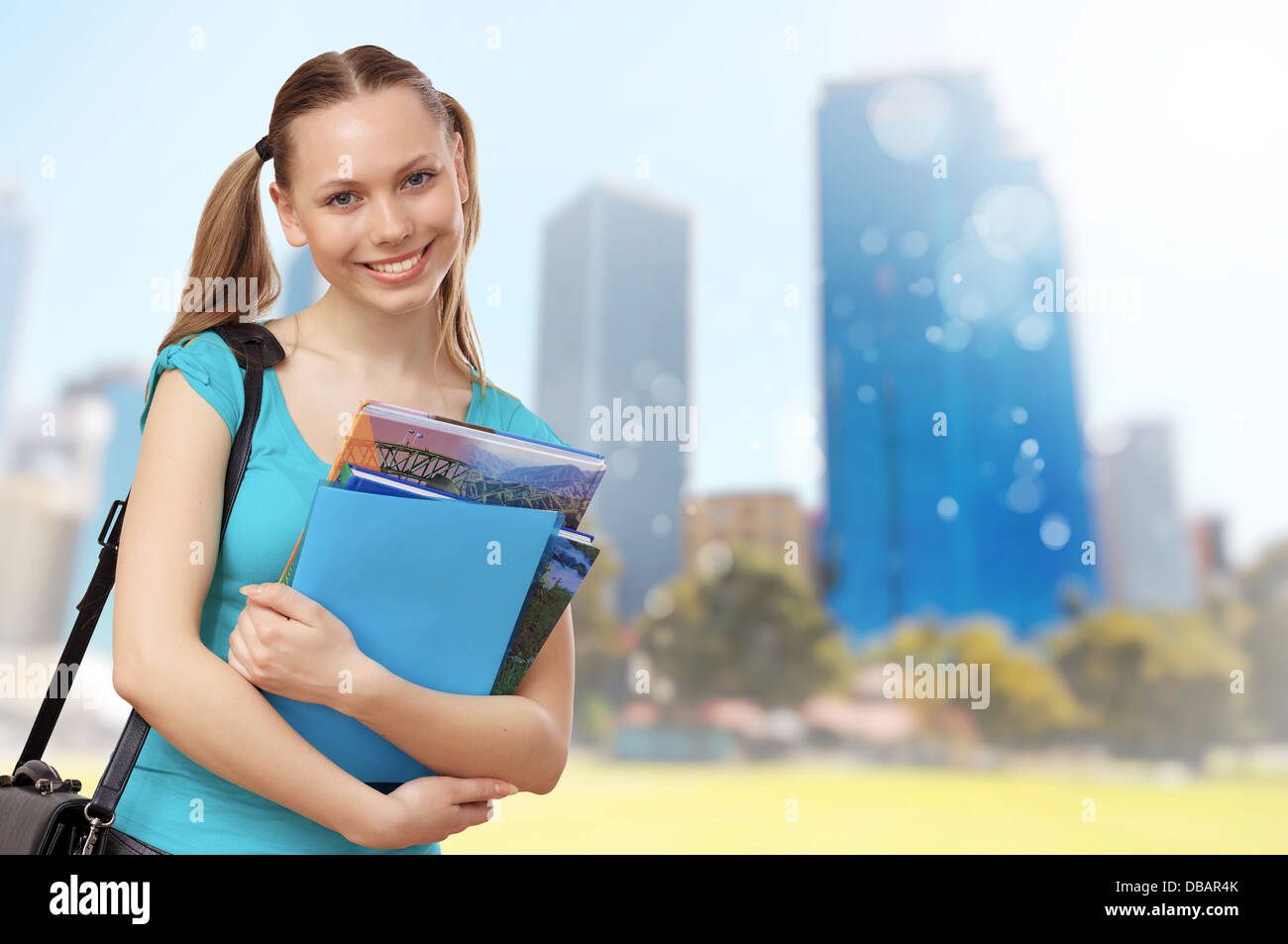Happy student with books Stock Photo - Alamy