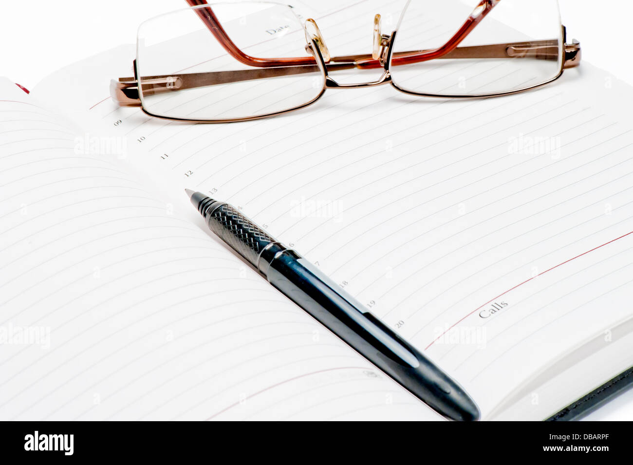 Opened diary, pen and glasses Stock Photo - Alamy