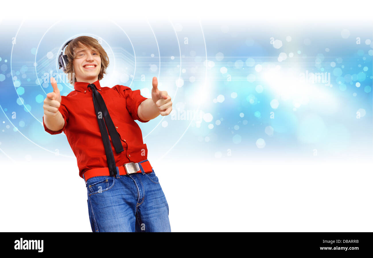 Happy smiling young man dancing Stock Photo - Alamy