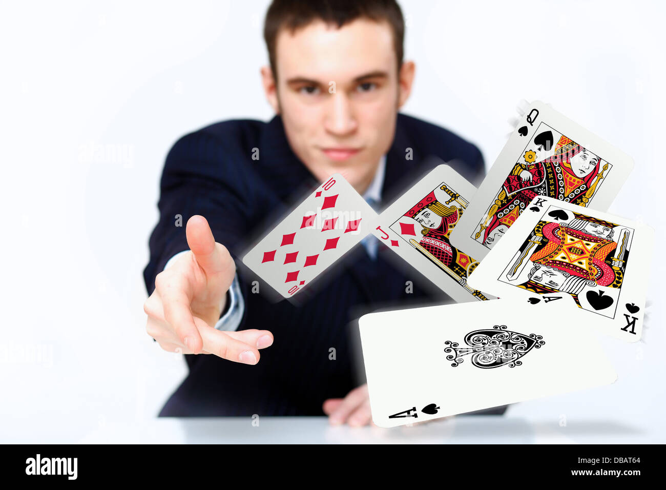 Young man showing poker cards Stock Photo - Alamy