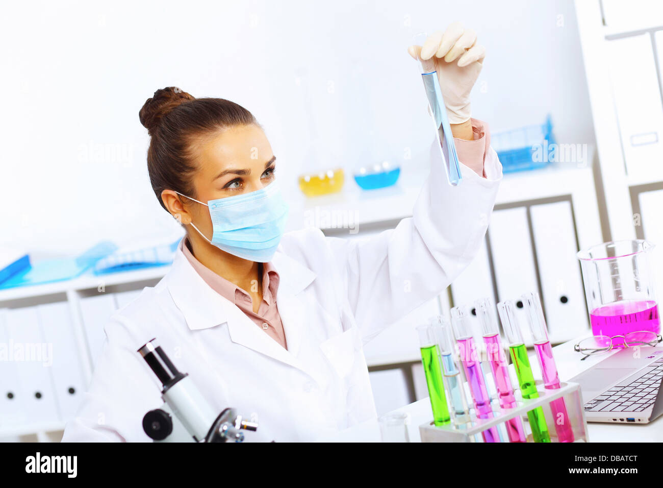 Young female scientist working in laboratory Stock Photo - Alamy