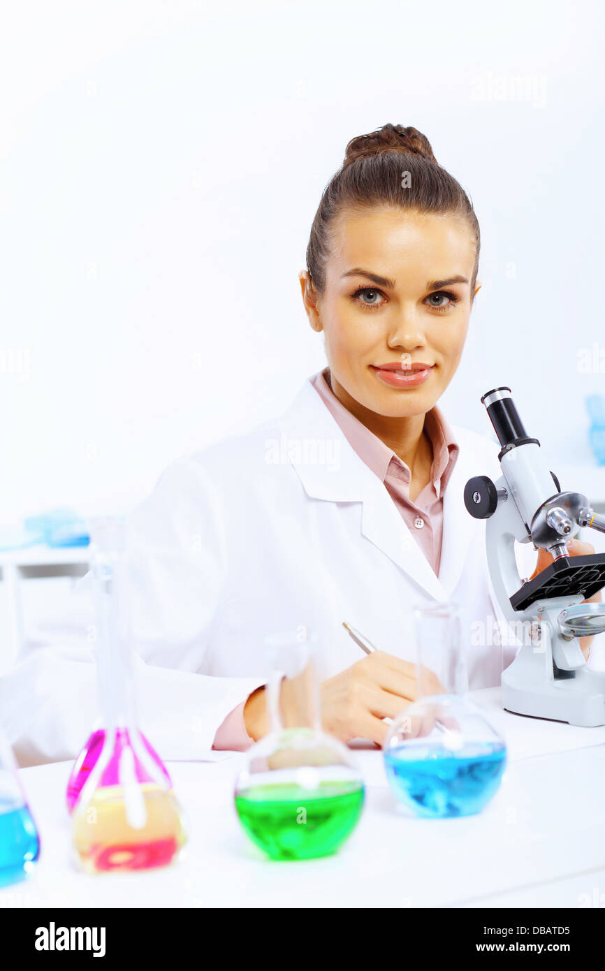 Young female scientist working in laboratory Stock Photo - Alamy