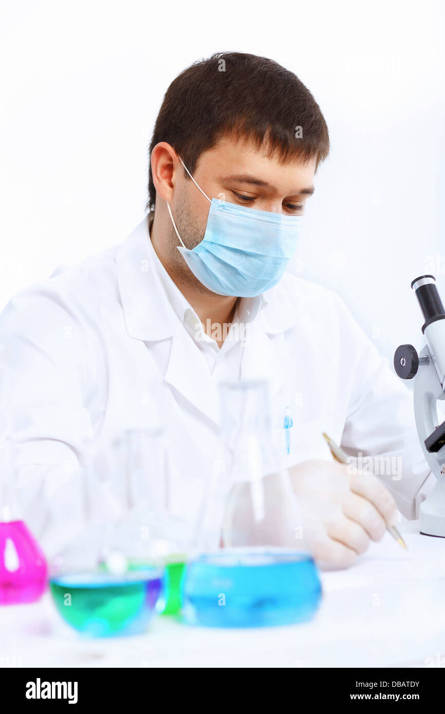 Young male scientist working in laboratory Stock Photo - Alamy