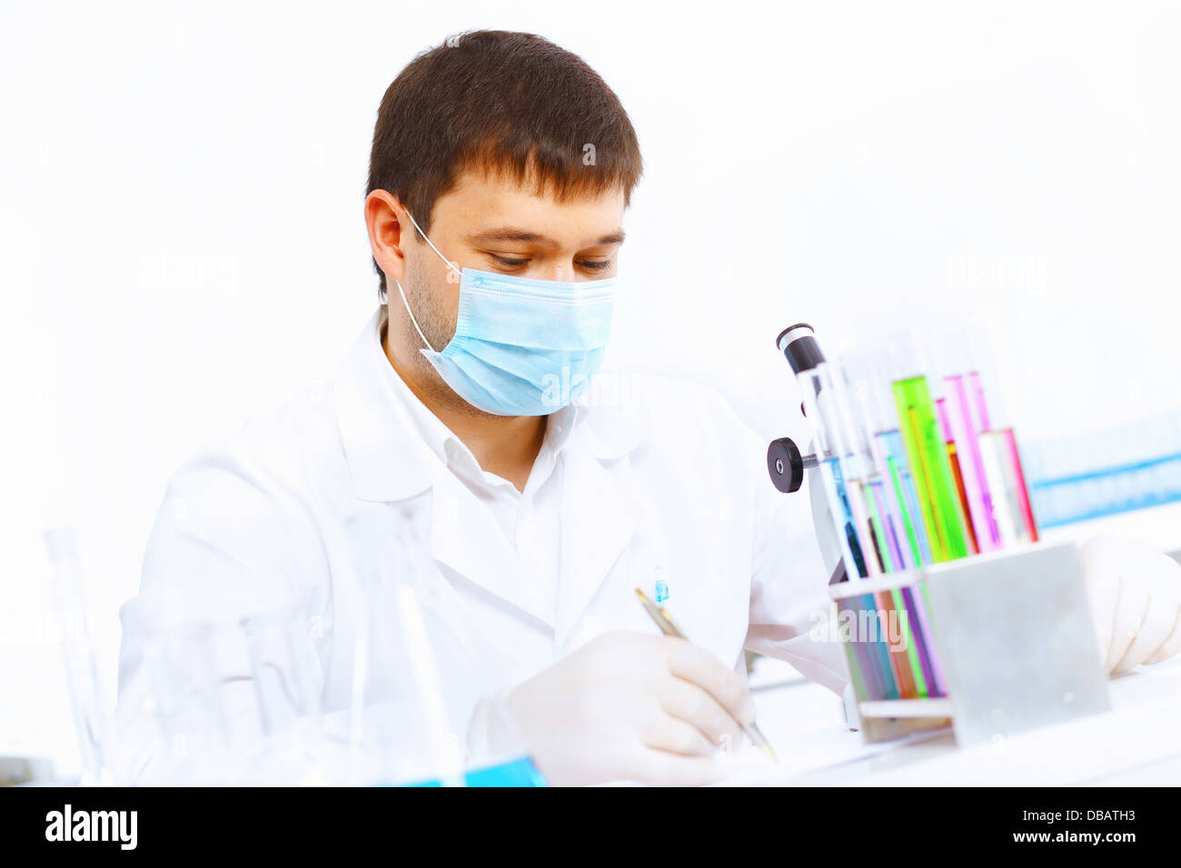 Young male scientist working in laboratory Stock Photo - Alamy