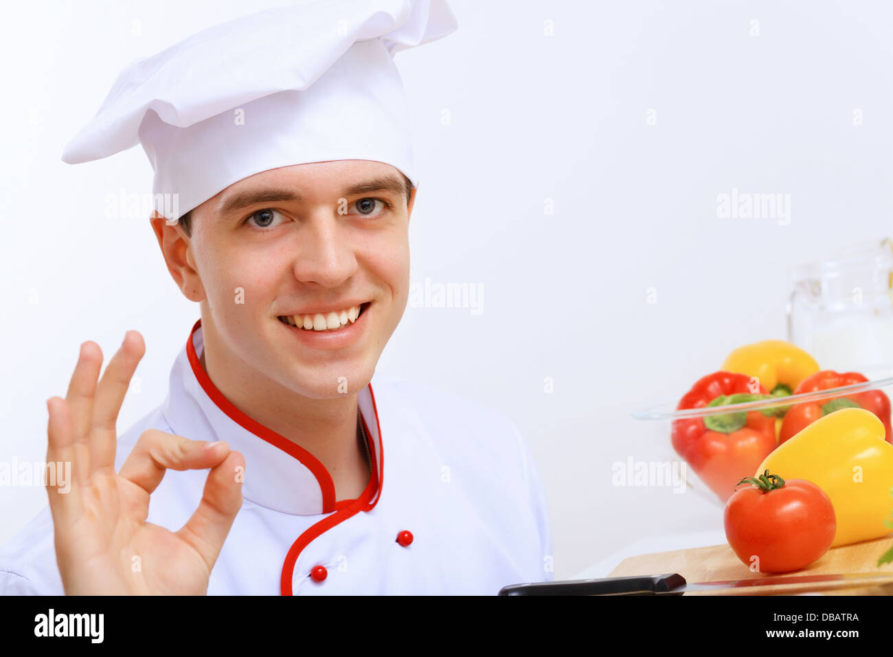 Young cook preparing food Stock Photo - Alamy