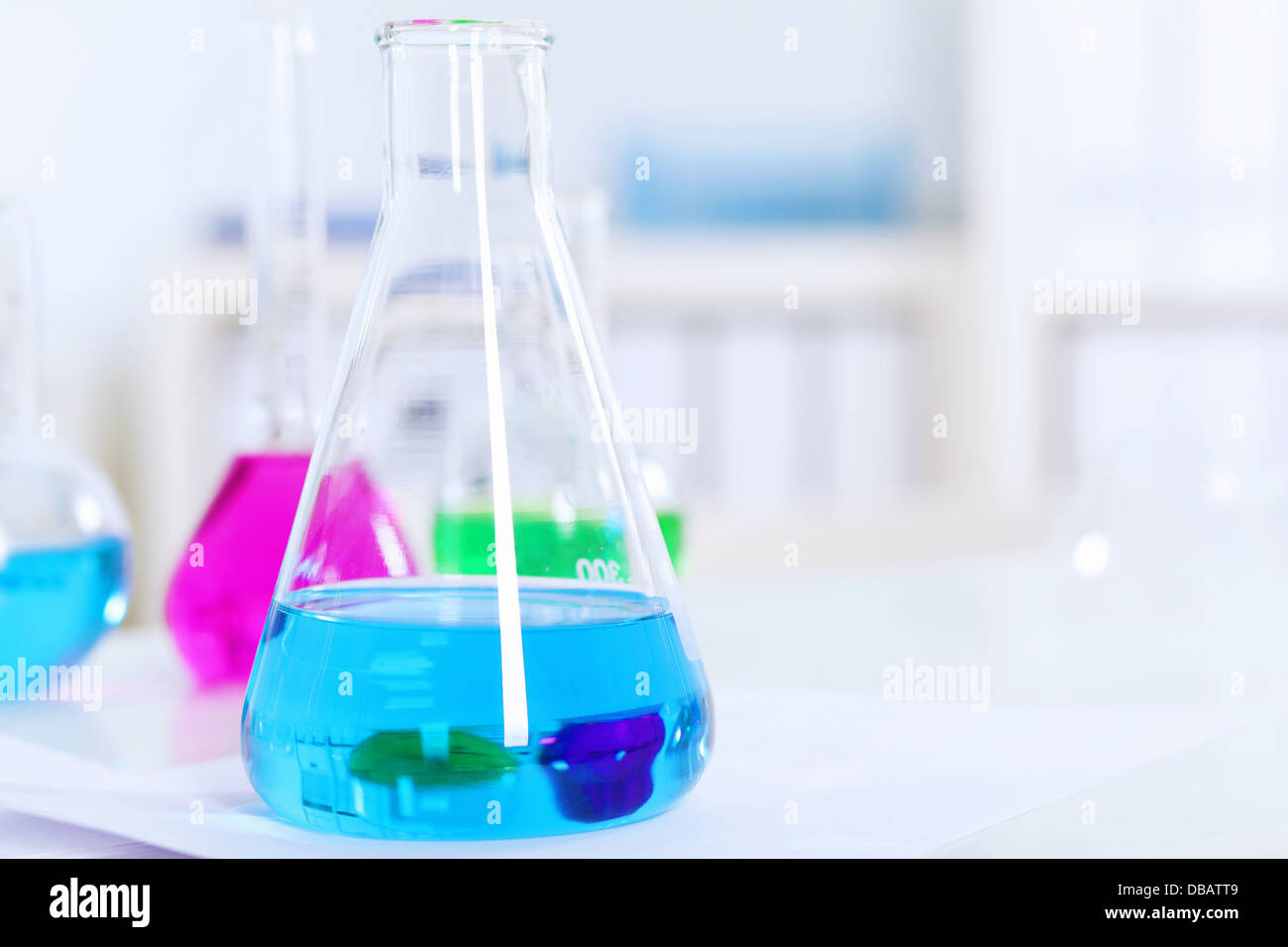 Chemistry laboratory glassware with colour liquids Stock Photo - Alamy