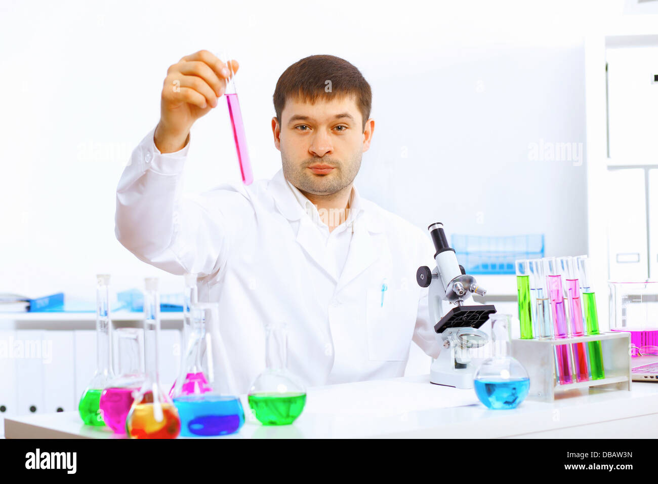 Young male scientist working in laboratory Stock Photo - Alamy