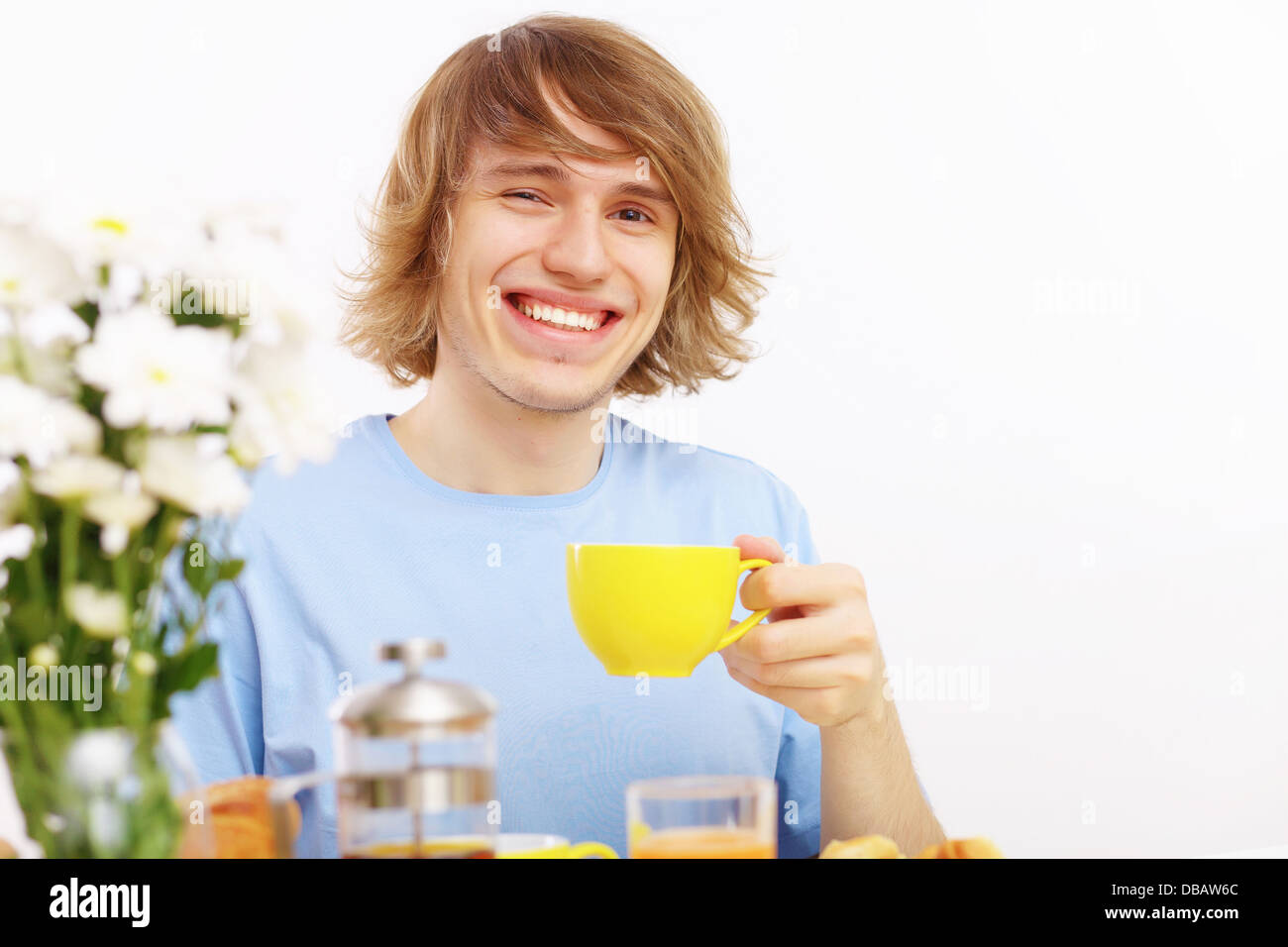Young happy man drinking tea Stock Photo - Alamy Young happy man drinking tea Stock Photo - Alamy