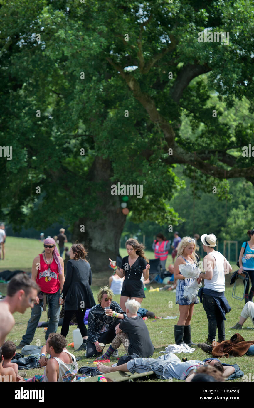 Glastonbury Festival 2013 UK Revellers relaxing near the stone circle ...