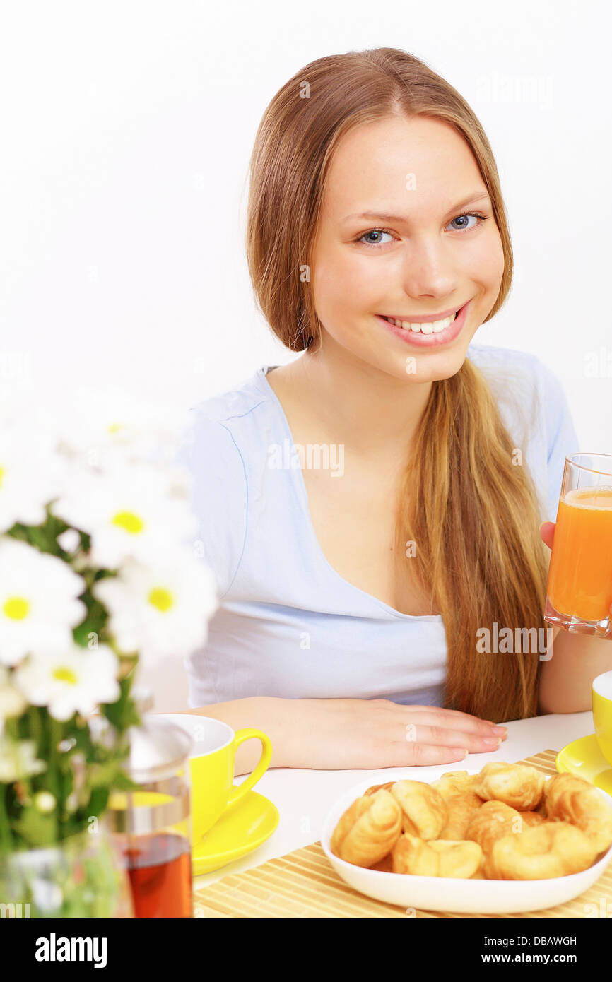 Beautiful young woman drinking tea Stock Photo - Alamy