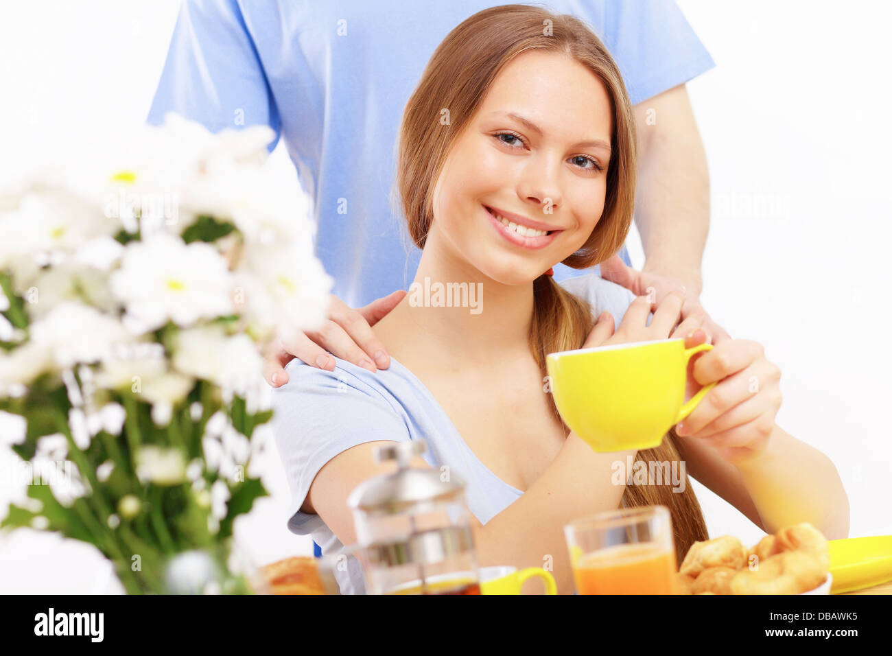 Beautiful young woman drinking tea Stock Photo - Alamy