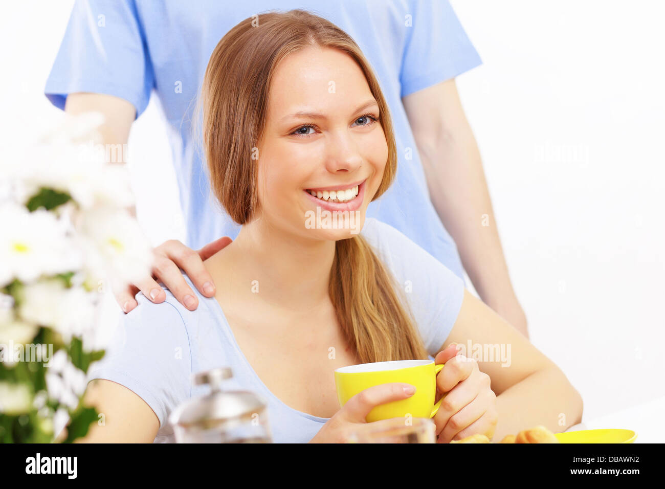 Beautiful young woman drinking tea Stock Photo - Alamy