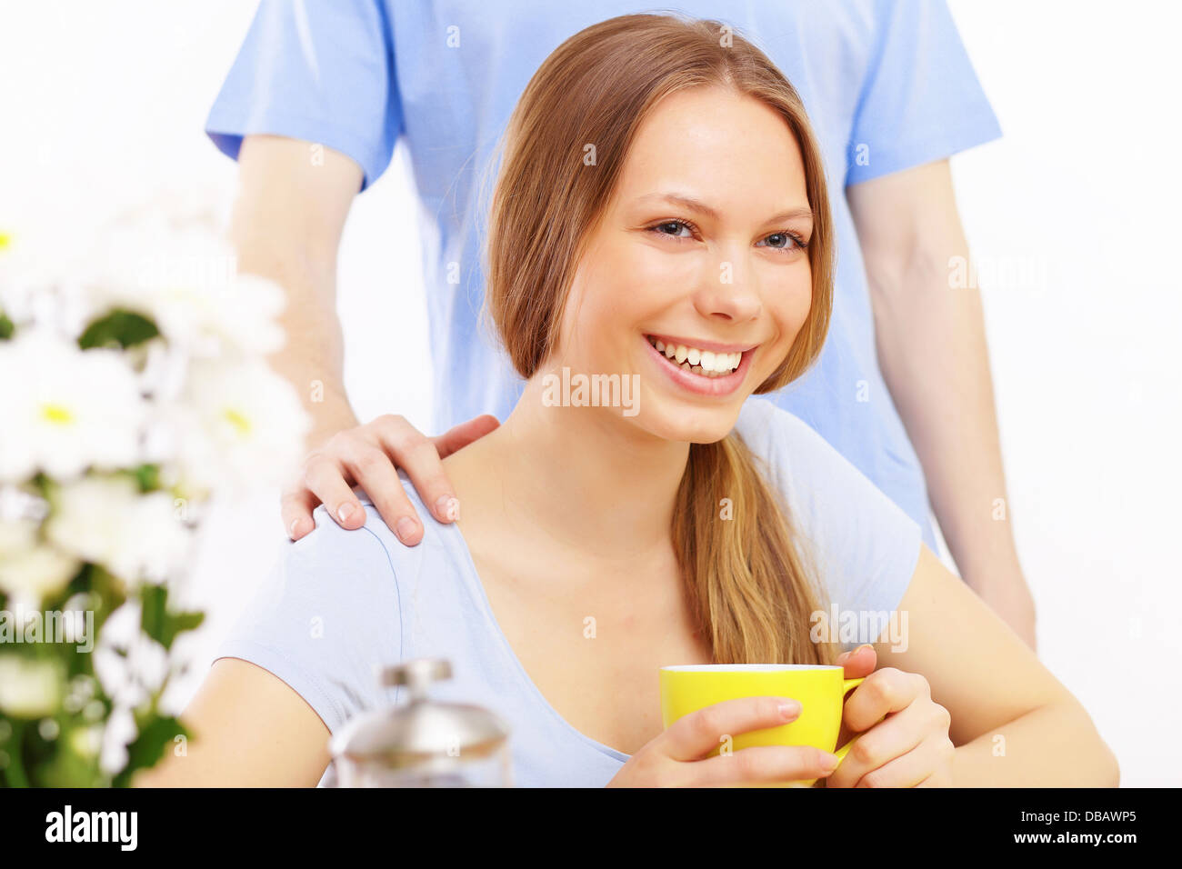 Beautiful young woman drinking tea Stock Photo - Alamy
