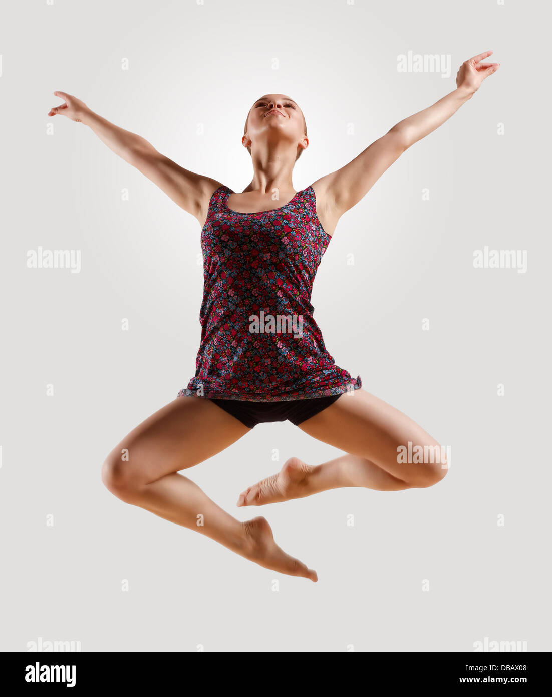 Girl in color dress dancing Stock Photo - Alamy