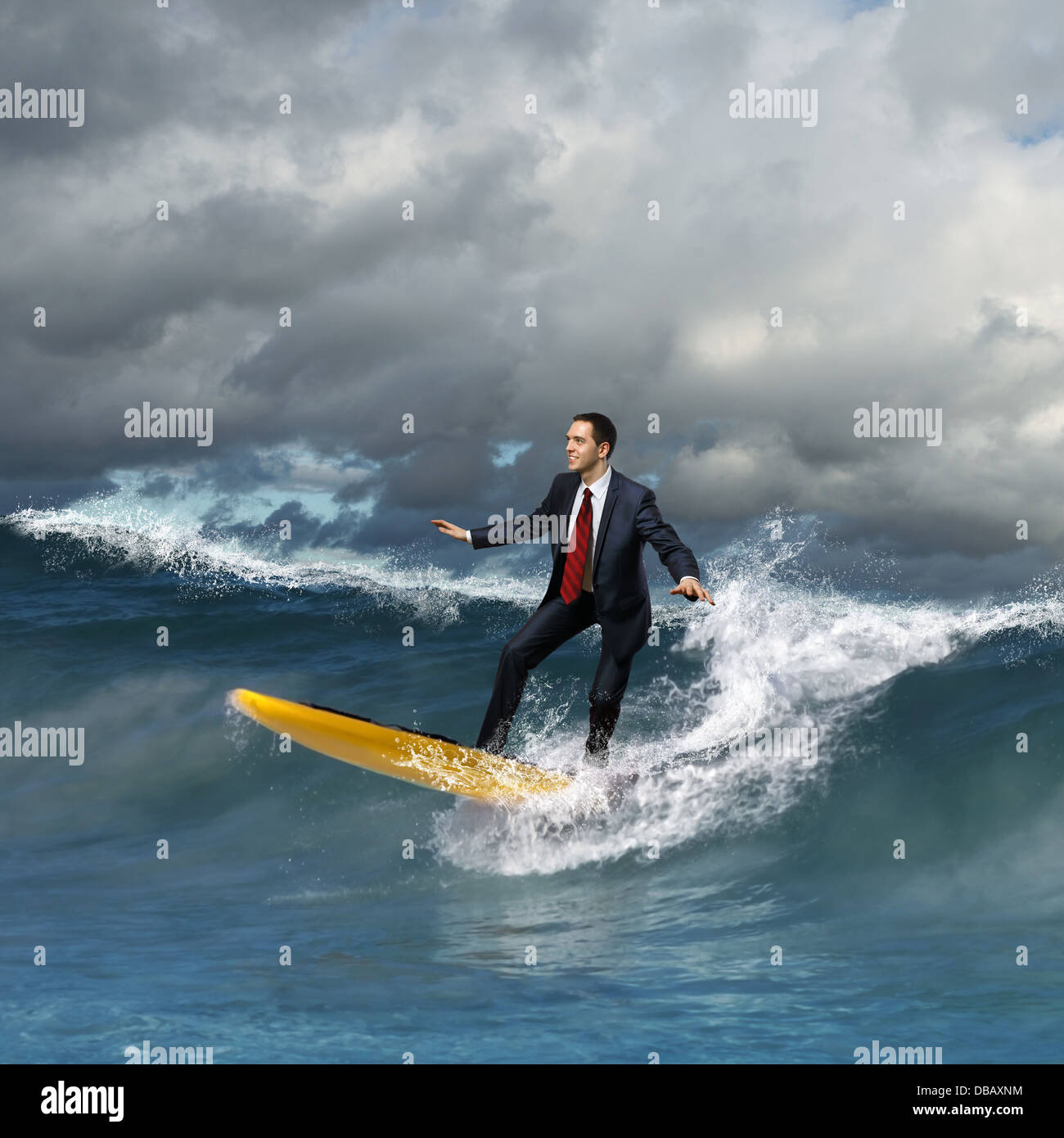 Young business person surfing on the waves Stock Photo - Alamy