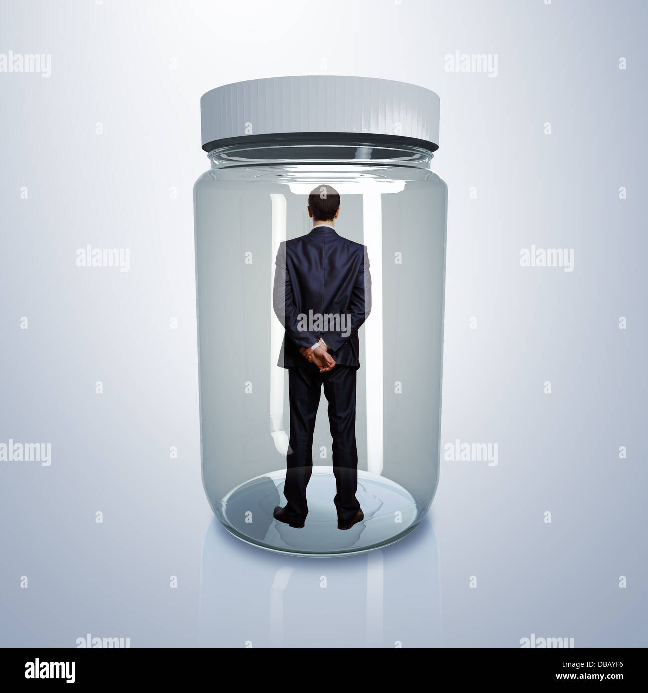 Businessman inside glass jar Stock Photo - Alamy