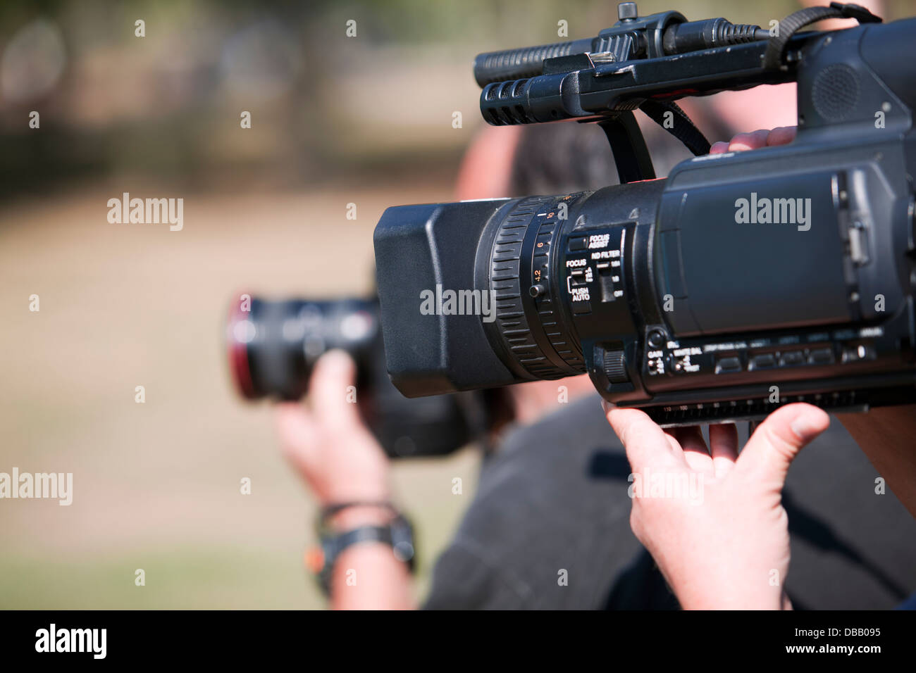 covering an event with a video camera Stock Photo - Alamy