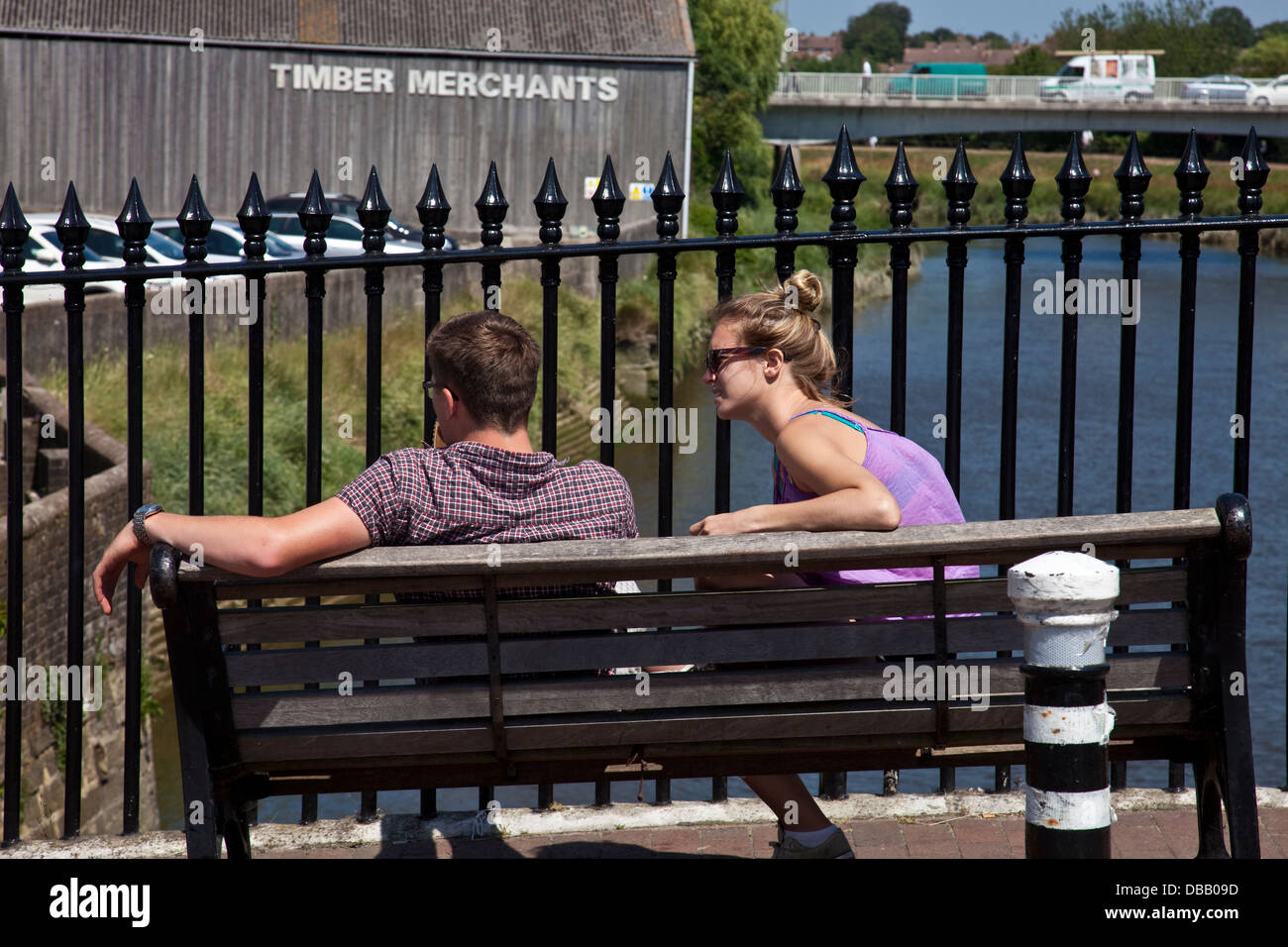 Couple sitting on a bench, Lewes, Sussex, England Stock Photo - Alamy