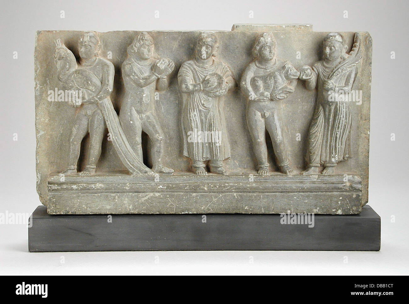 This stone relief depicts an offering scene, where figures present ...