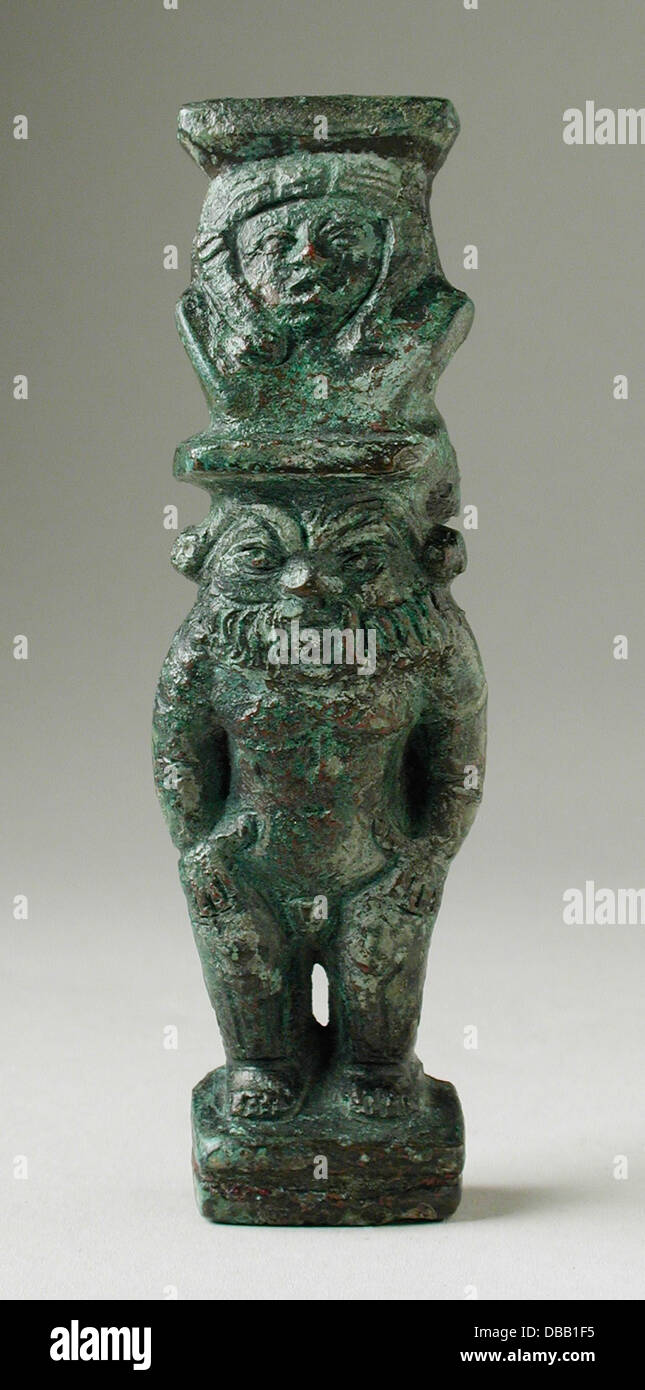 This figurine represents Bes, an ancient Egyptian deity, adorned with a ...