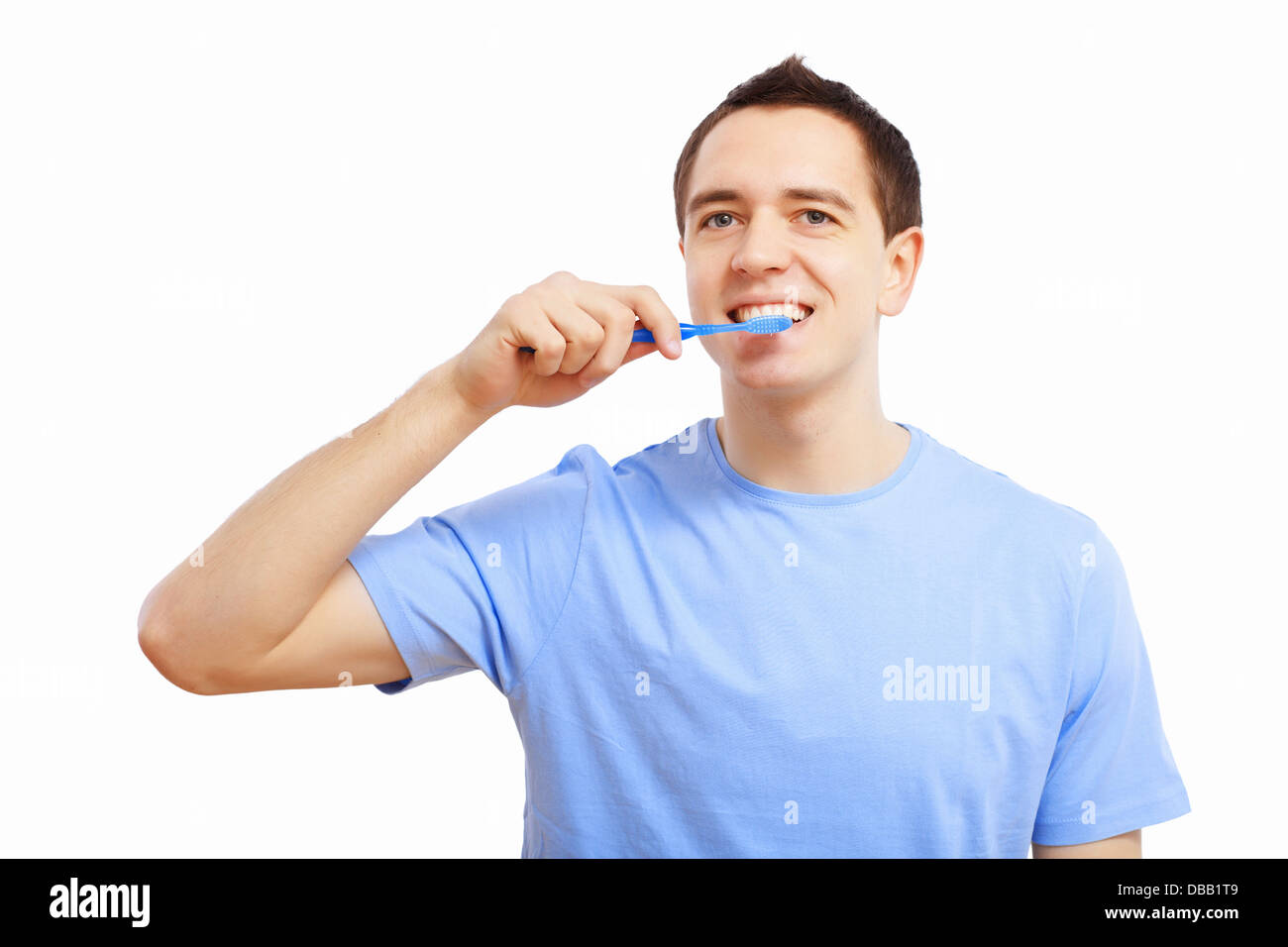 Young man at home brushing teeth Stock Photo - Alamy