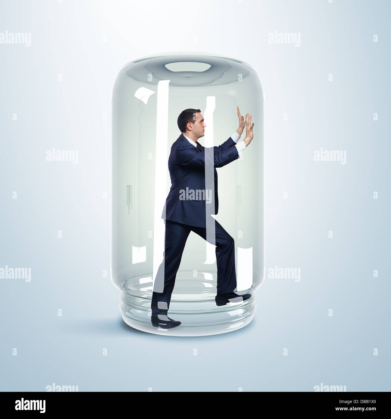 Businessman inside glass jar Stock Photo - Alamy