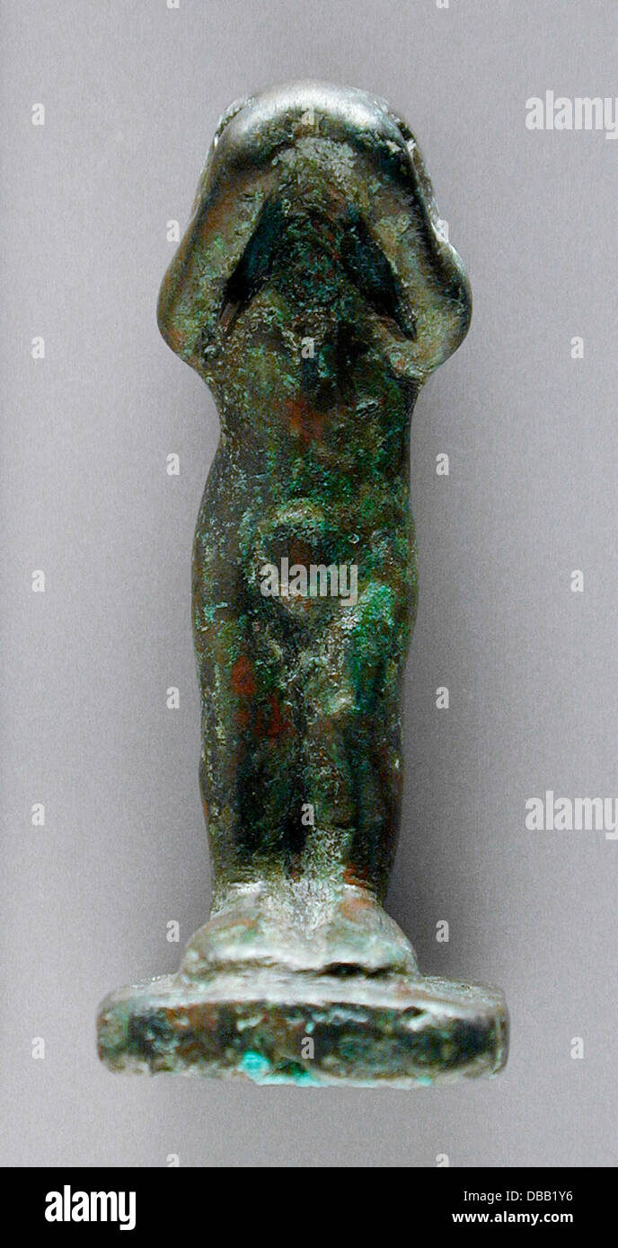 This figurine depicts a figure in an emotional or ritualistic pose ...