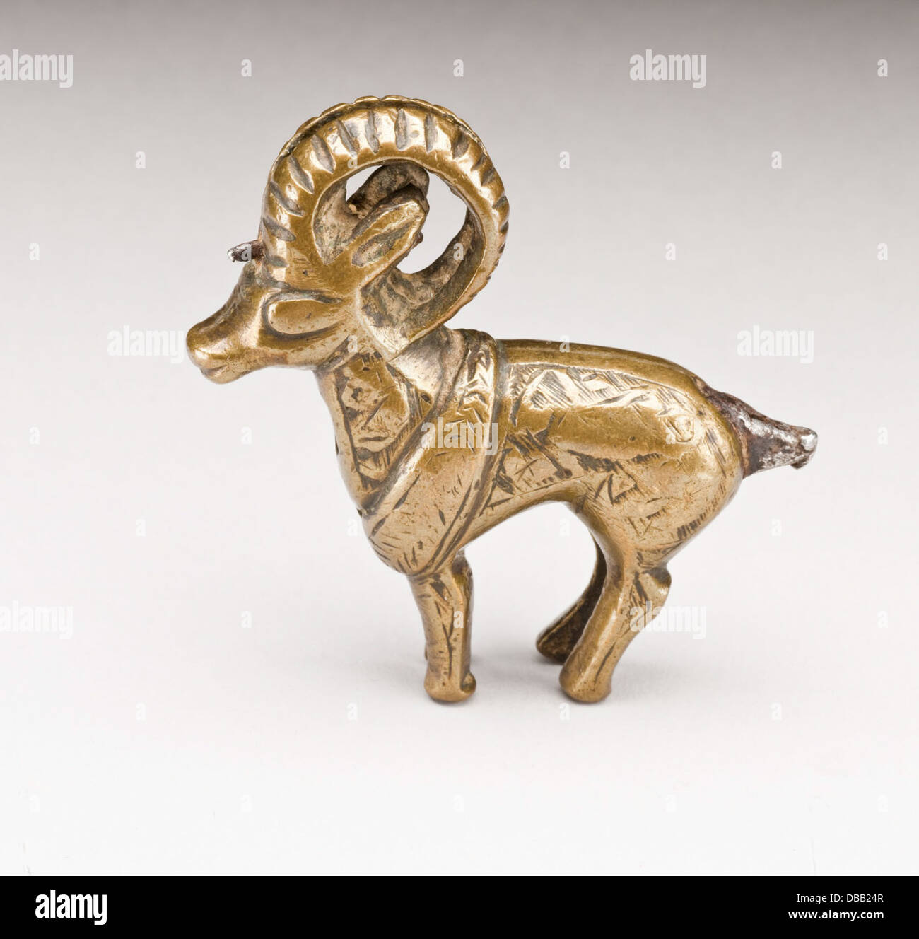 This bronze statue of a standing ram is a remarkable example of animal ...