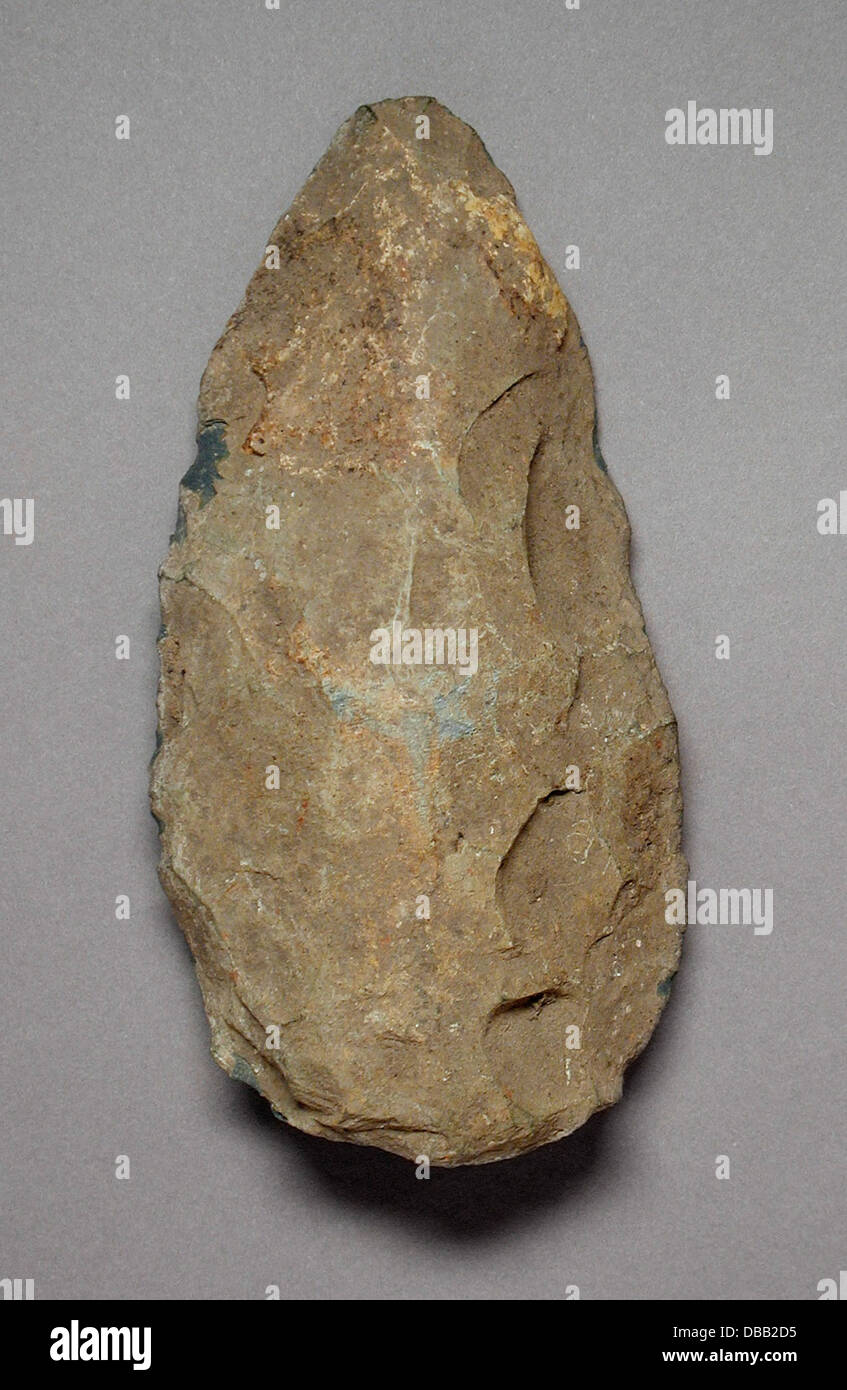 This stone axe is an ancient tool, crafted from stone and used in ...